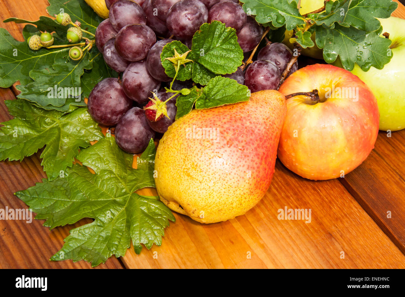 Assorted fruit on the old wooden table top Stock Photo - Alamy