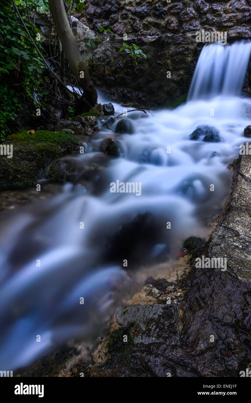 Flowing water stream Stock Photo - Alamy