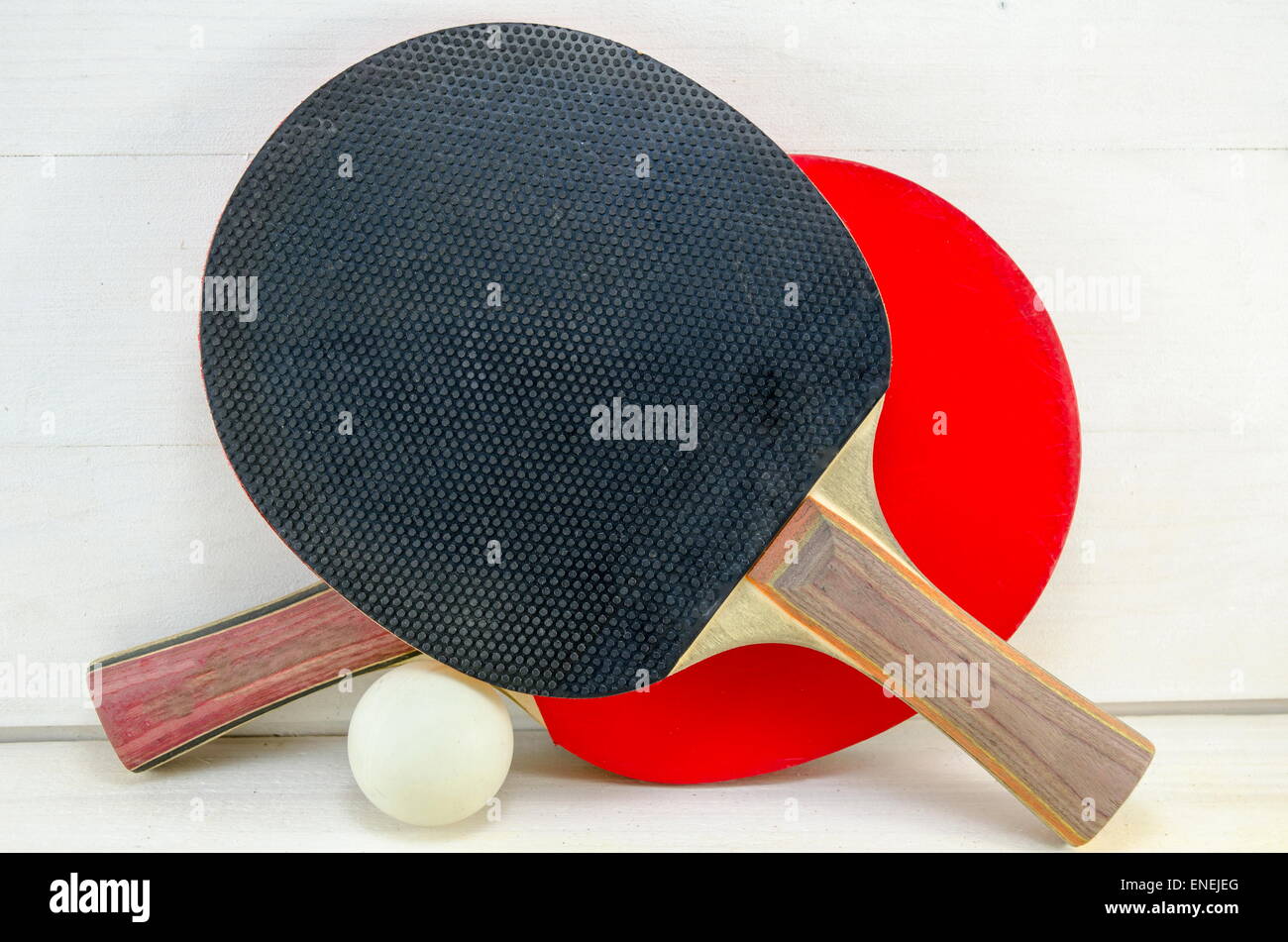 Two ping-pong rackets and a ball isolated on white Stock Photo - Alamy