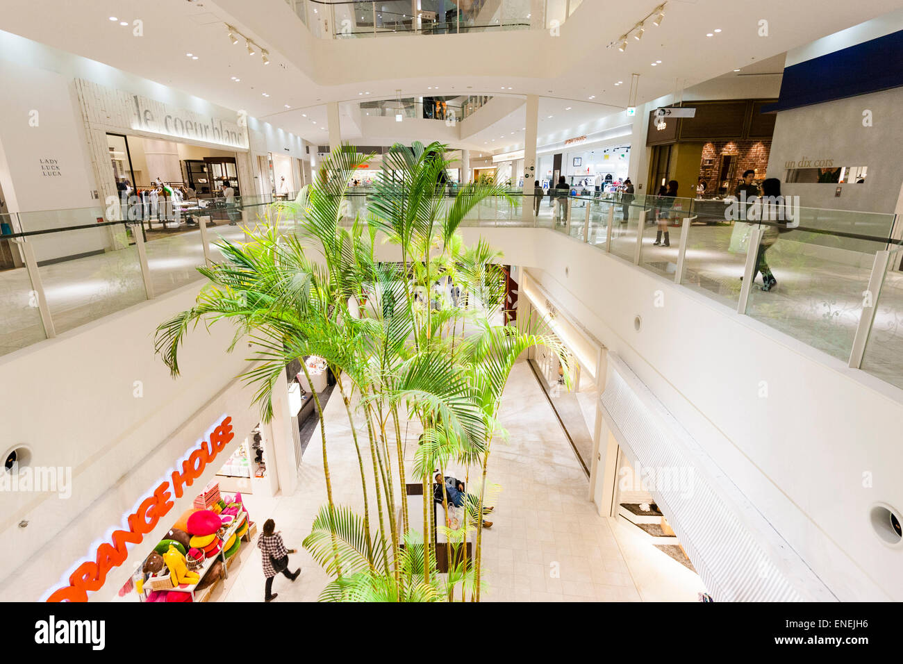 Interior of the brightly lit fashionable Nishinomiya Gardens shopping ...