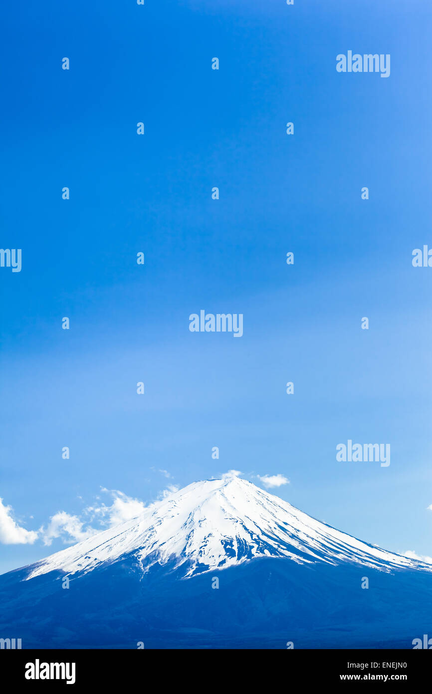 Beautiful snowy Mt. Fuji in front of the blue sky with large copy space ...