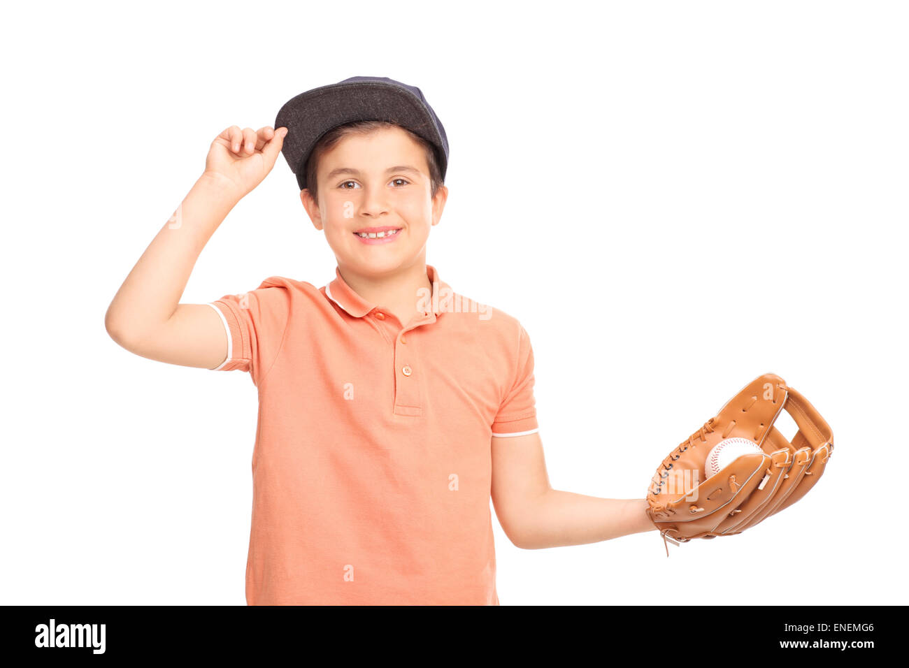 Cheerful little boy with a blue cap holding a baseball and looking at ...