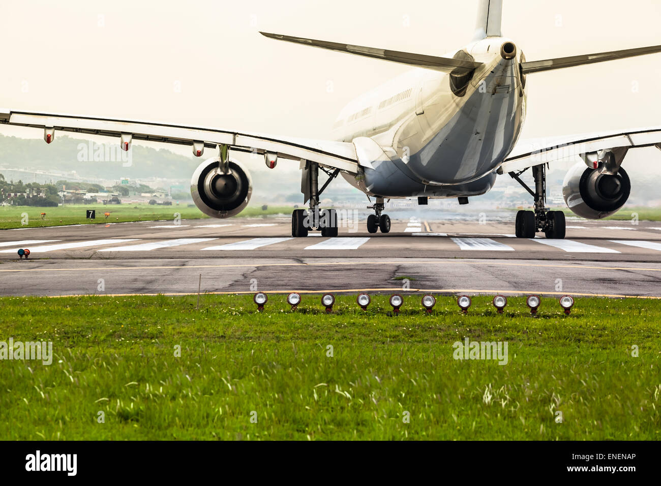 Airplane goes to the position for takeoff at an airport runway Stock ...