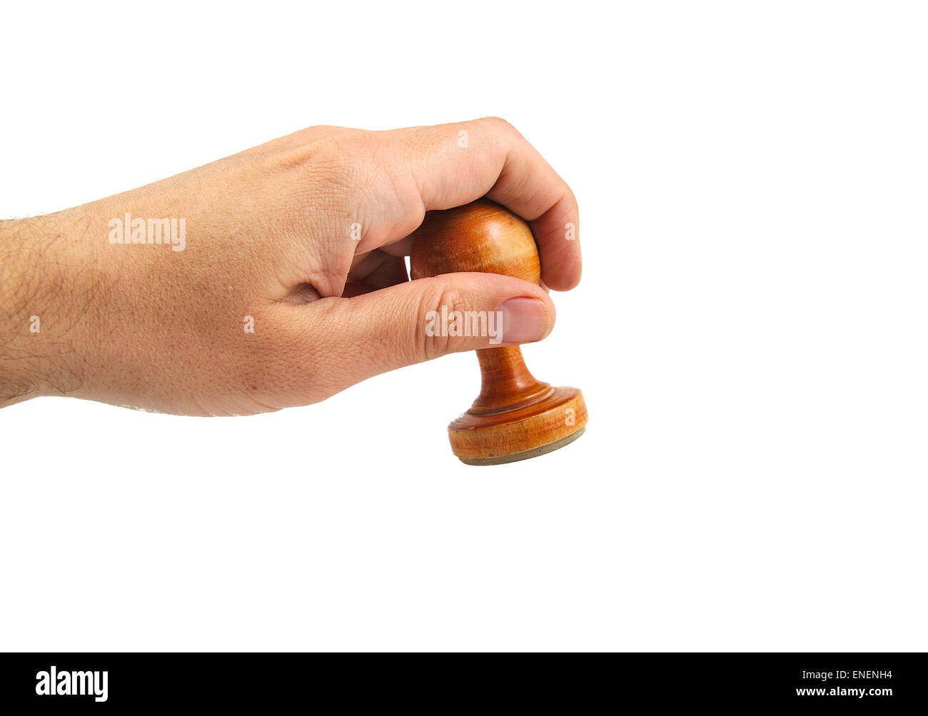 Hand stamping with an old and vintage wooden stamper isolated on white ...