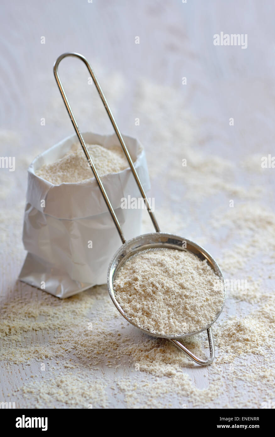 Oatmeal flour bag and colander Stock Photo - Alamy