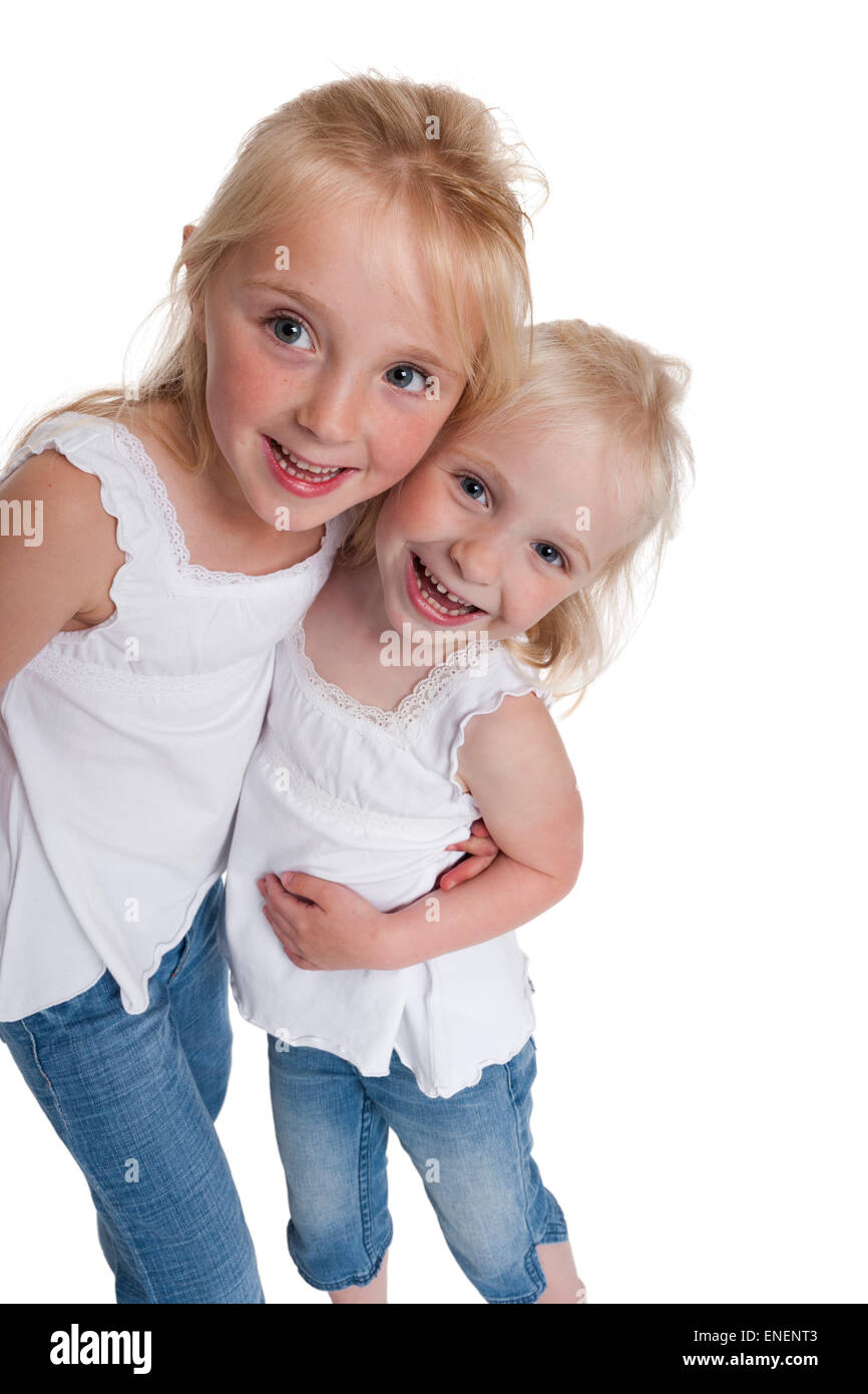 Portrait Of Two Blond Sisters Having Fun On White Background Stock 2235