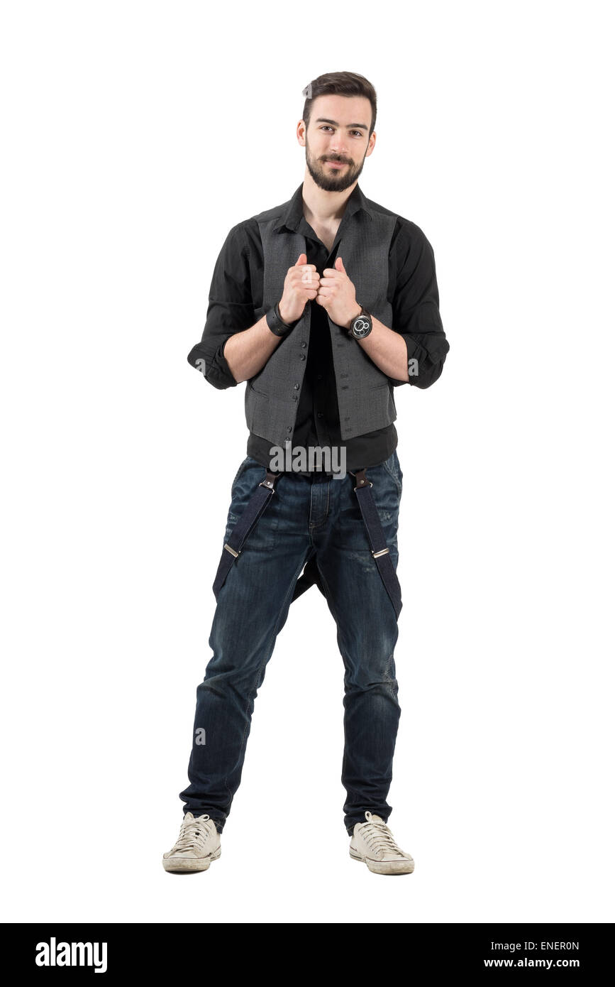 Smiling positive young man holding his vest looking at camera. Full ...