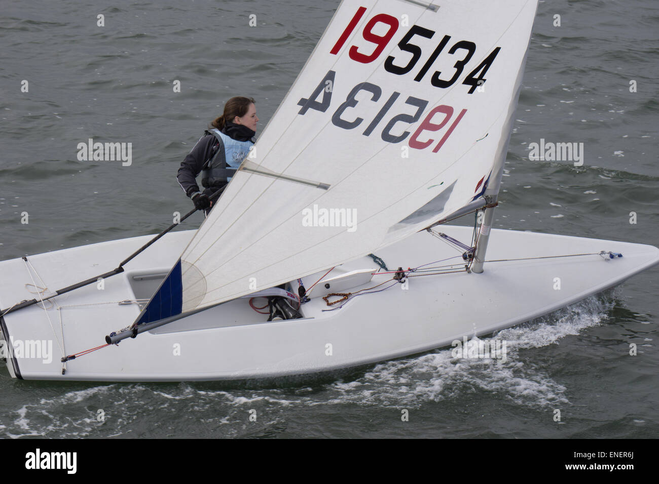 Woman sailing Laser Sailing Dinghy Stock Photo - Alamy