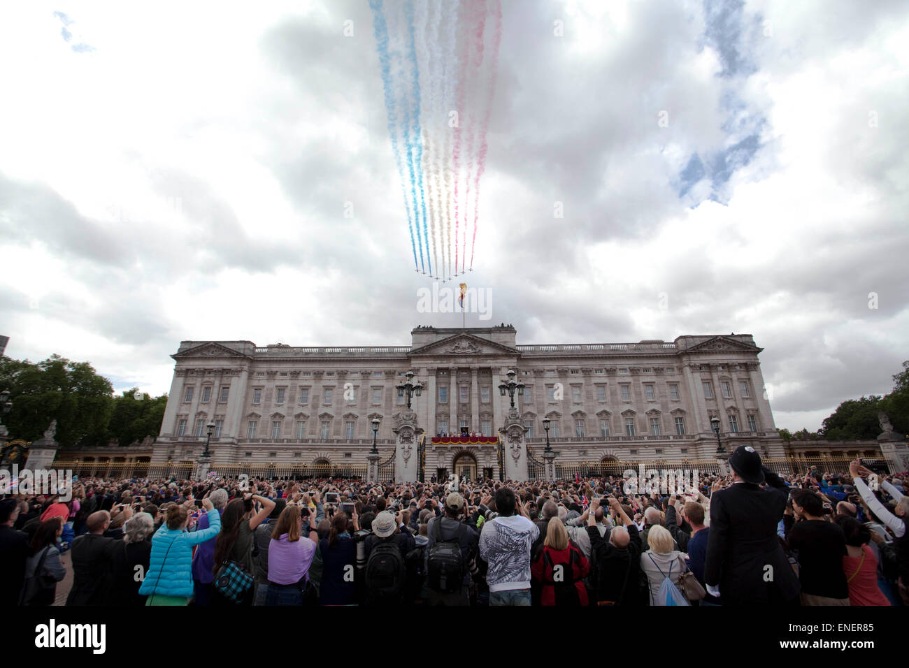 The crowd watch as red arrows fly over Buckingham Palace for the Trooping the Colour parade for ...