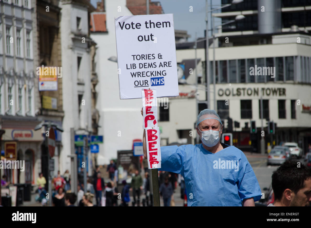 Protester dressed as surgeon with placard to save NHS Stock Photo - Alamy