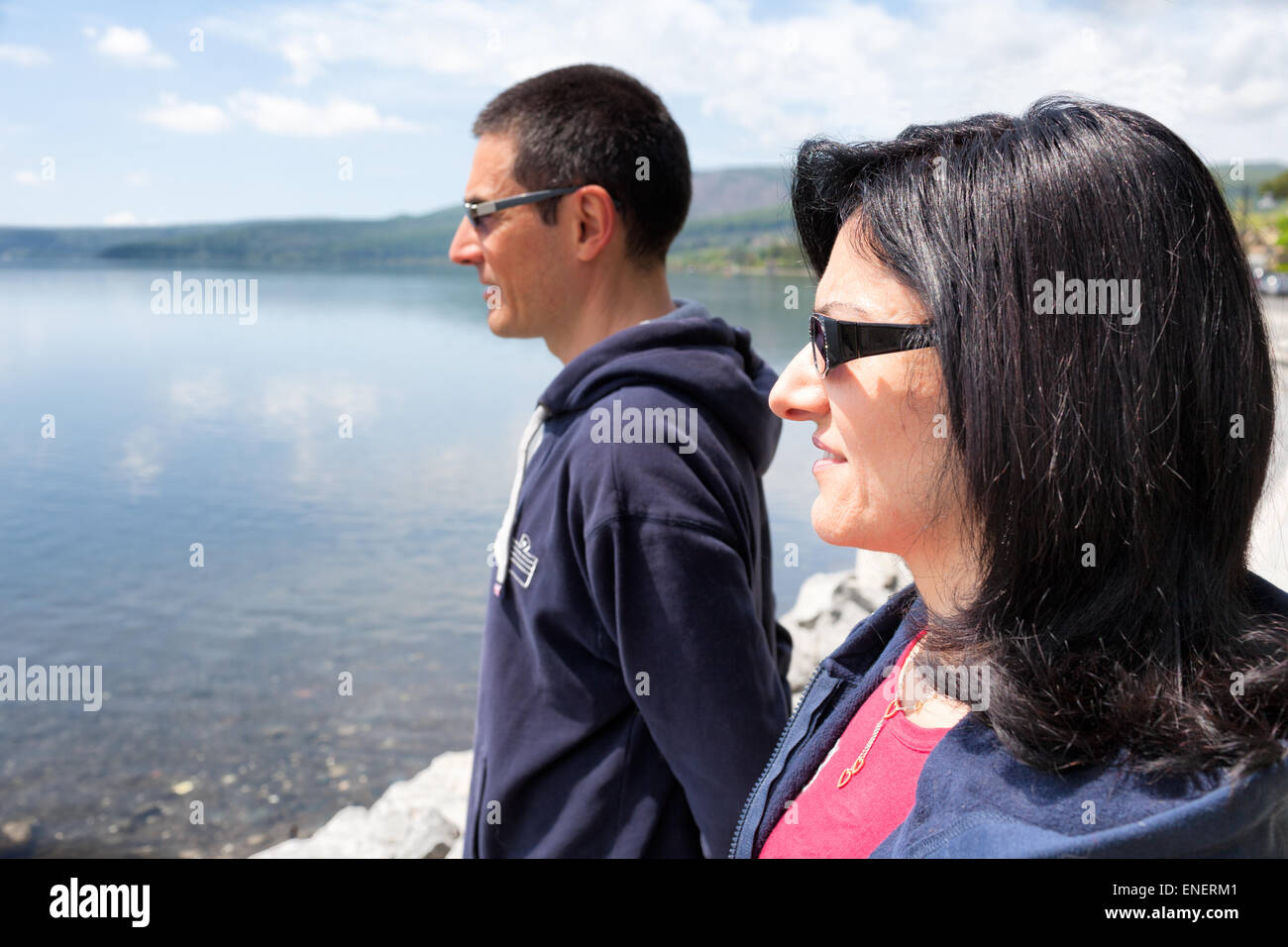 Couple Watching Lake Stock Photo - Alamy
