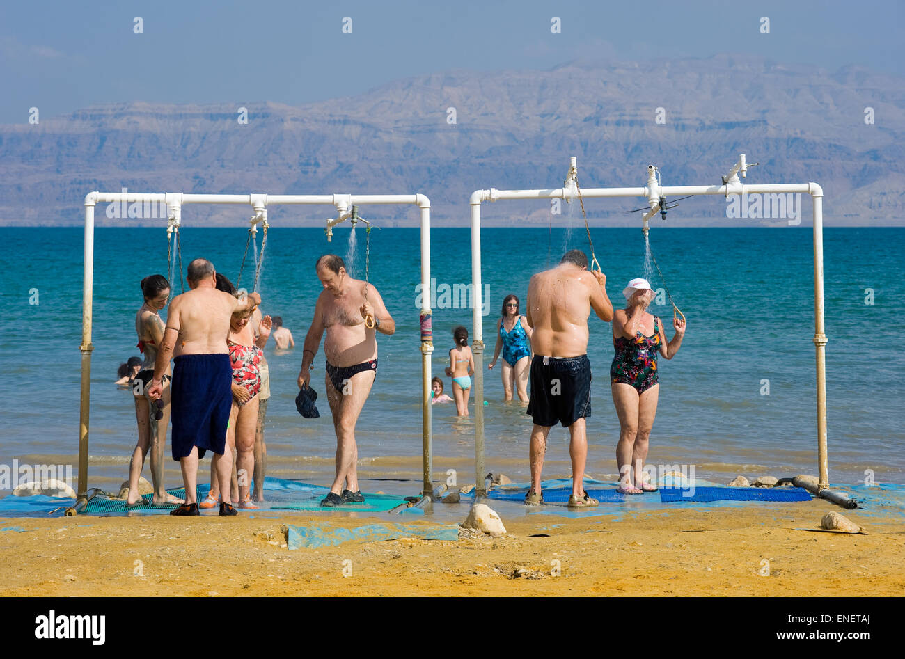 DEAD SEA, ISRAEL - OCT 13, 2014: People are taking a shower after they ...