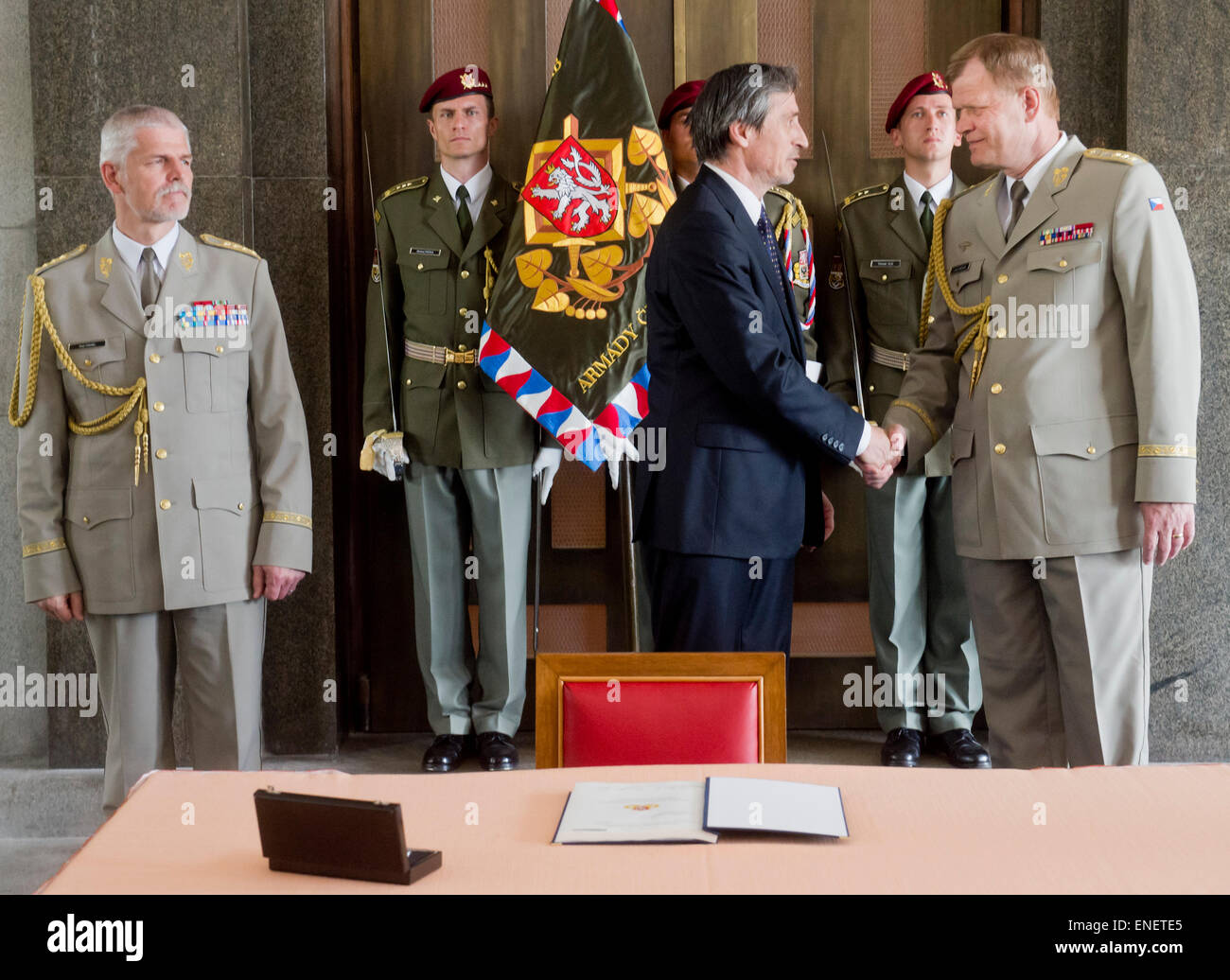 Czech Defence Minister Martin Stropnicky (center) congratulates to ...