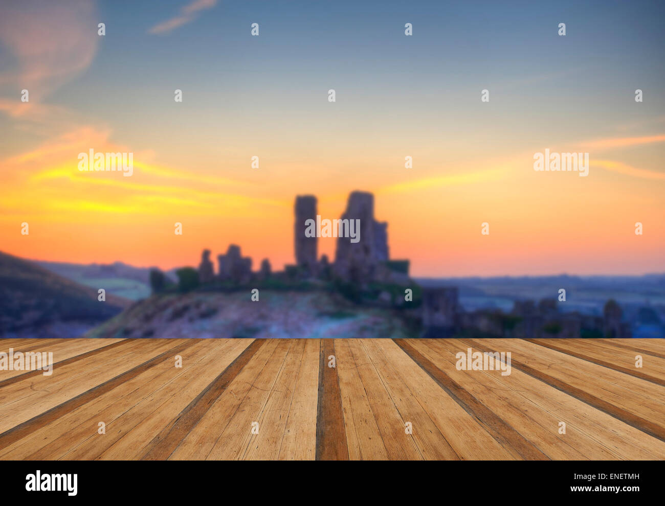 Winter pre-dawn colorful sunrise over Castle with wooden planks floor ...