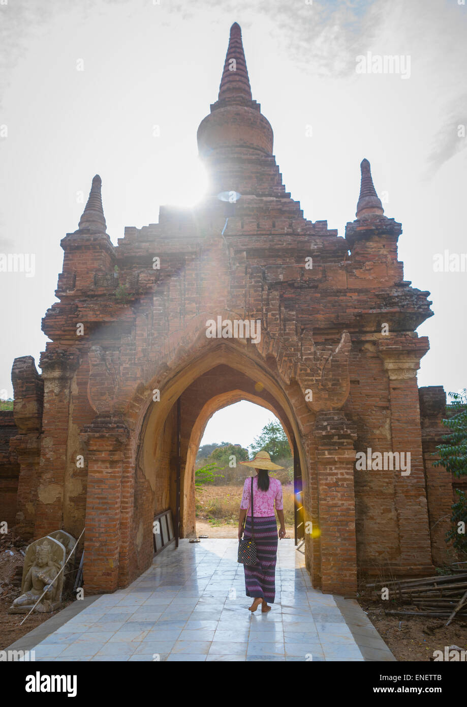Woman Going Out Of An Old Temple Gate, Bagan, Myanmar Stock Photo - Alamy