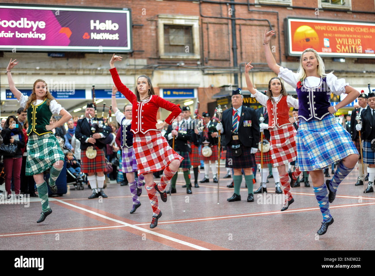 Highland dancers perform on Poppy Day in Victoria Station. Where ...