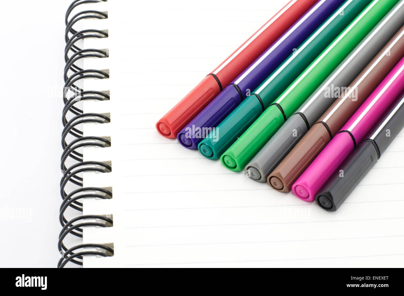 colorful pen with notebook isolated on white background Stock Photo - Alamy