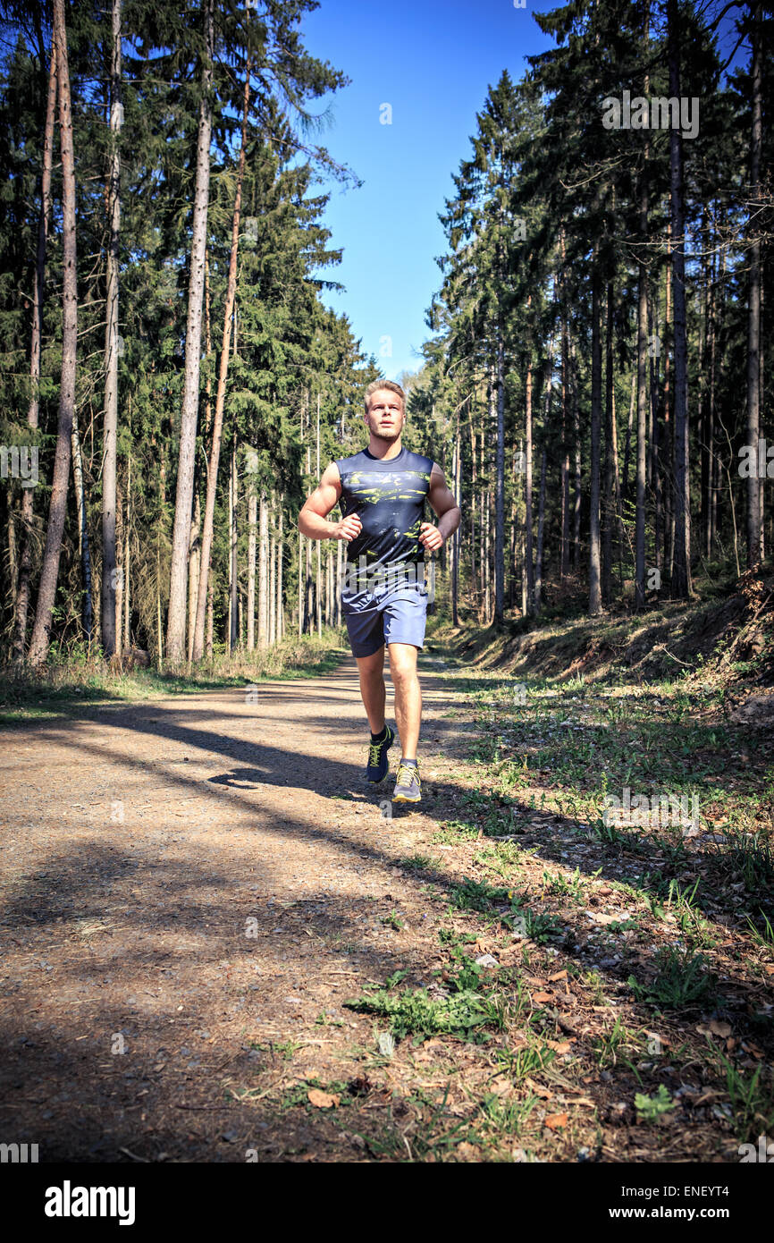 Young man running on trail hi-res stock photography and images - Alamy