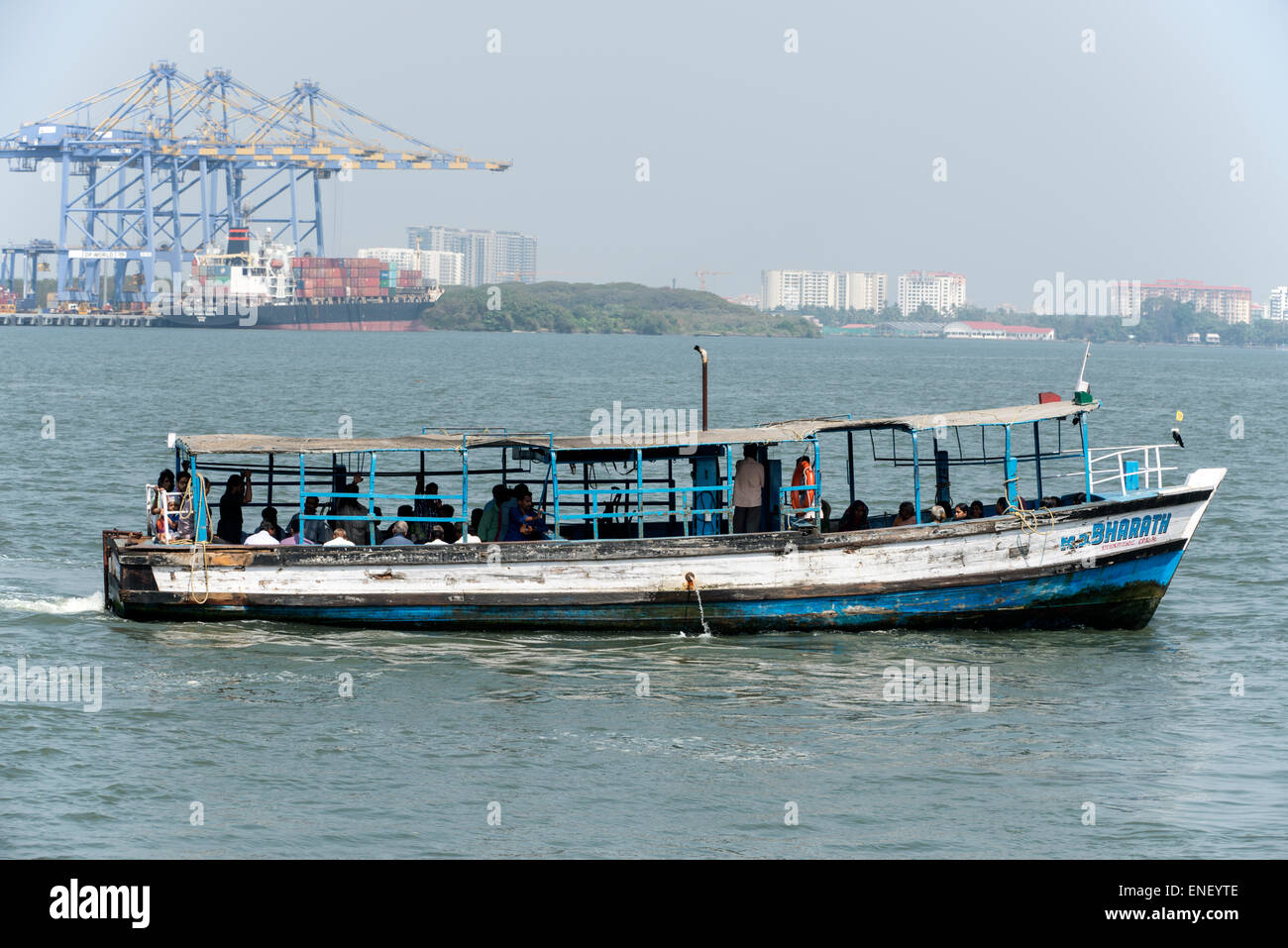 A commuter boat ferries local residents from Fort Cochin to Kochi city ...