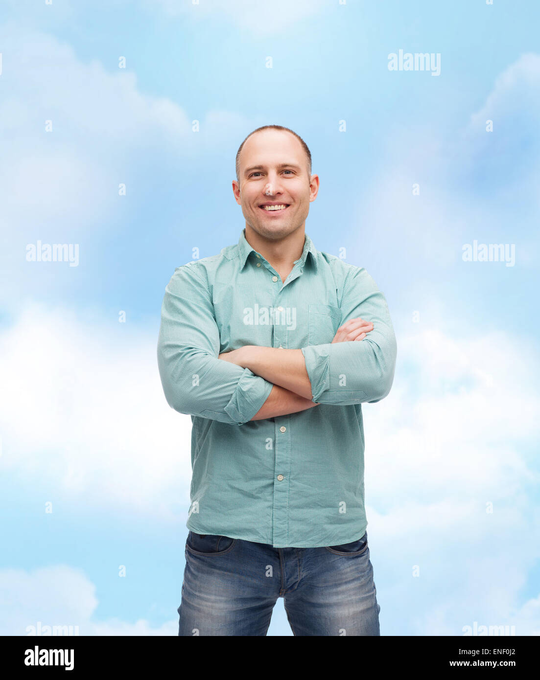 smiling man with crossed arms Stock Photo - Alamy
