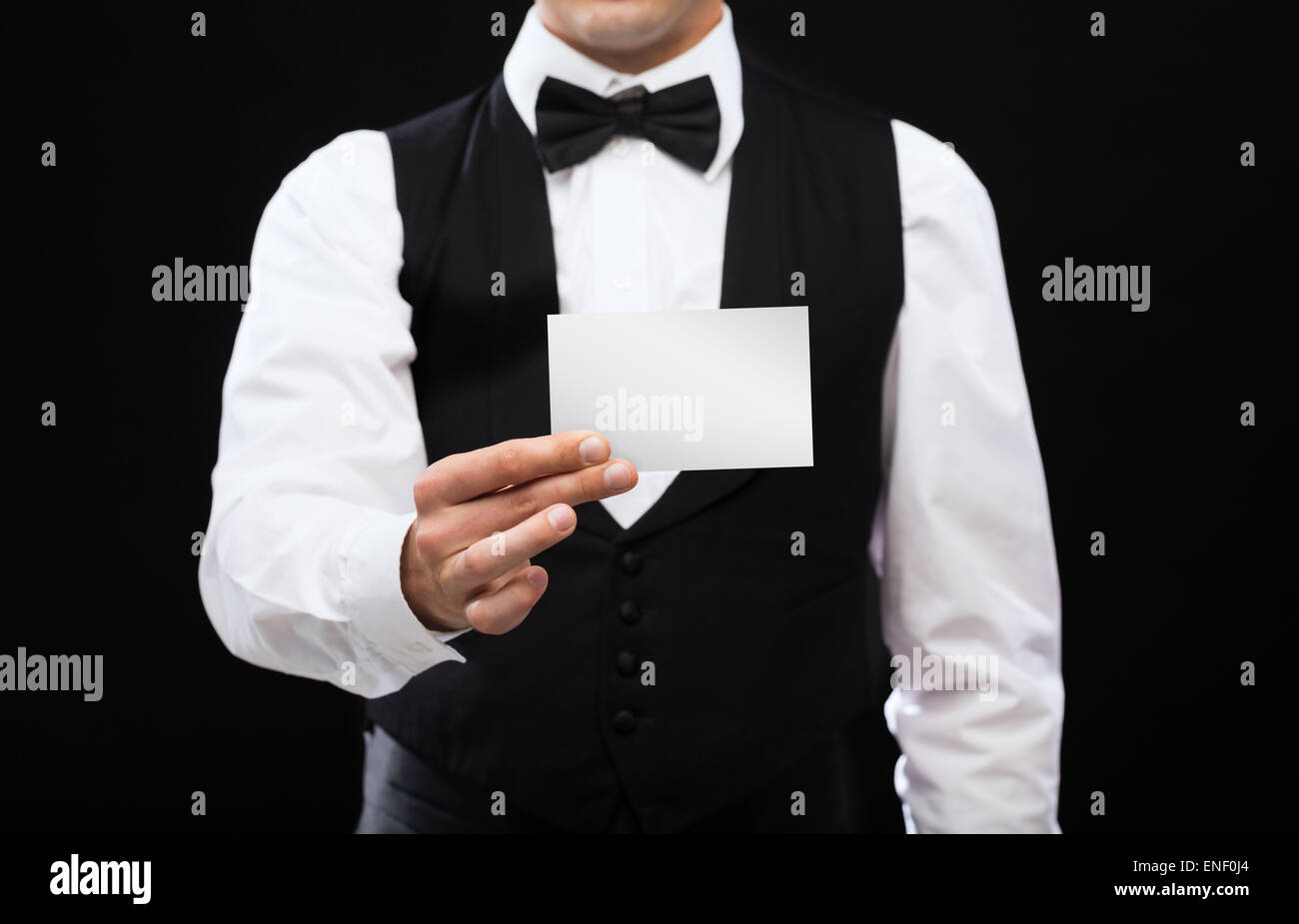 dealer holding white card Stock Photo - Alamy