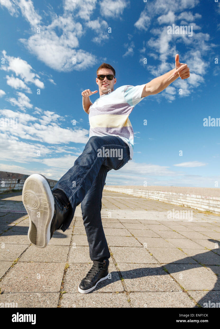 handsome boy making dance move Stock Photo - Alamy