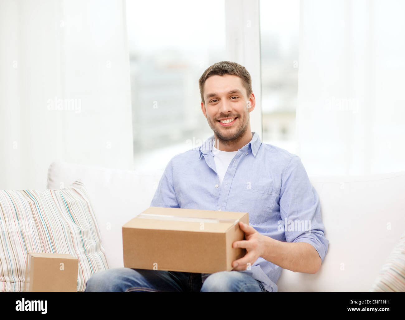 man with cardboard boxes at home Stock Photo - Alamy