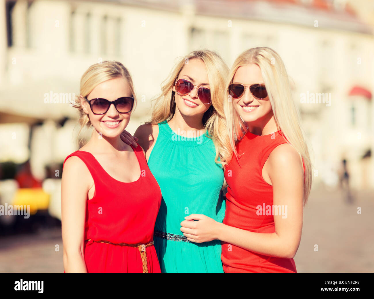 three beautiful women in the city Stock Photo - Alamy