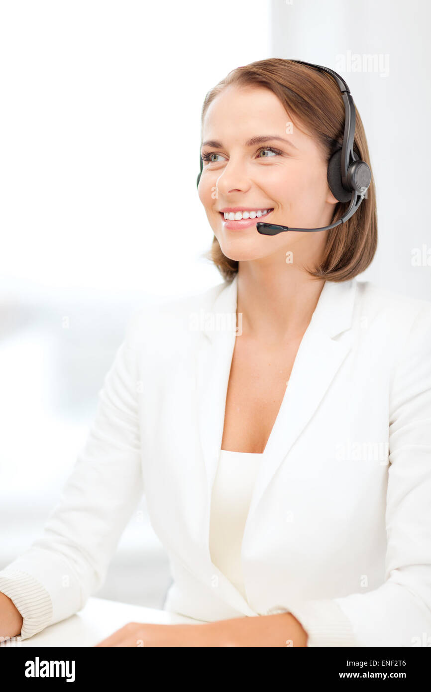 smiling female helpline operator with headphones Stock Photo - Alamy