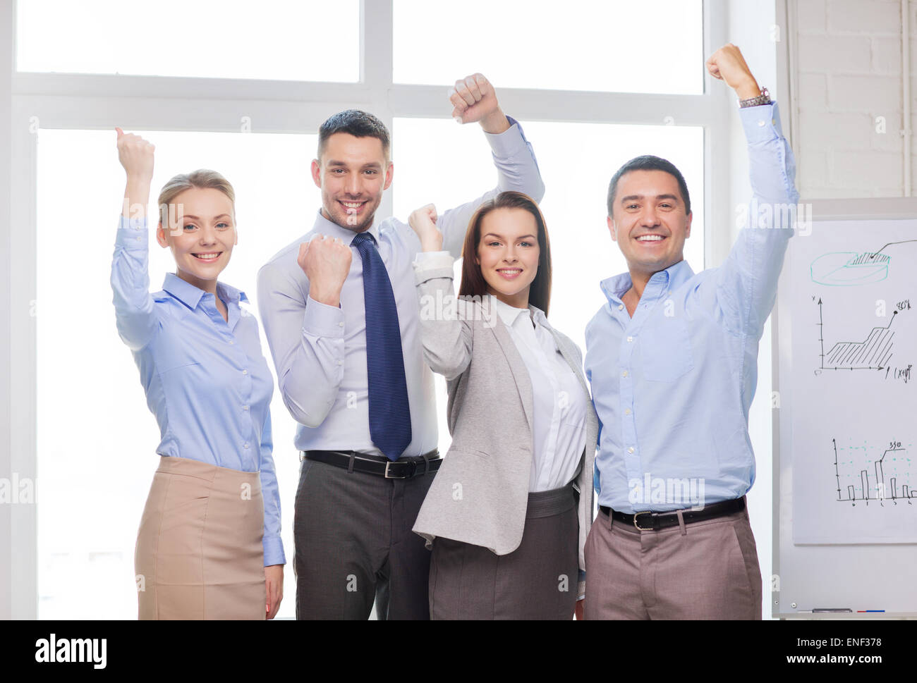 business team celebrating victory in office Stock Photo - Alamy