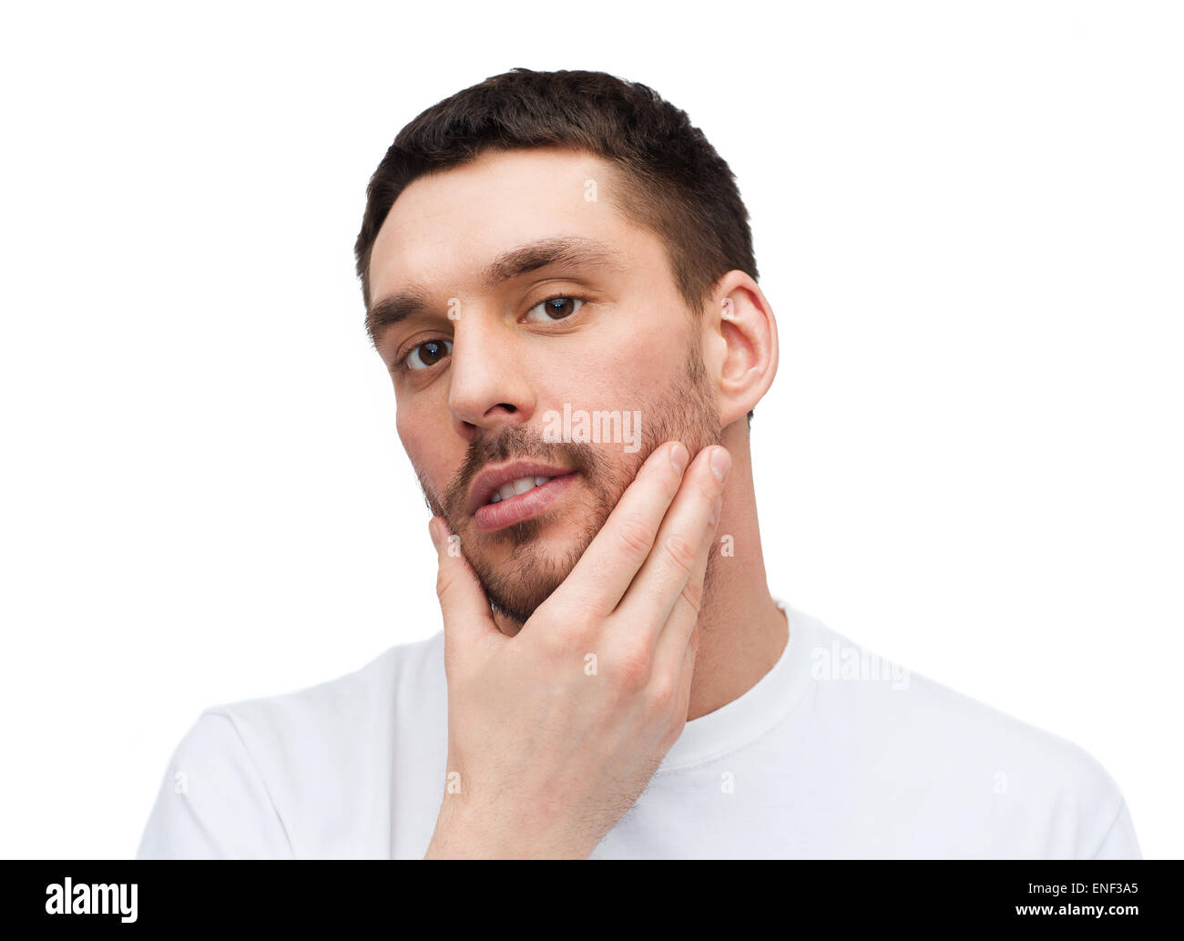 beautiful calm man touching his face Stock Photo - Alamy