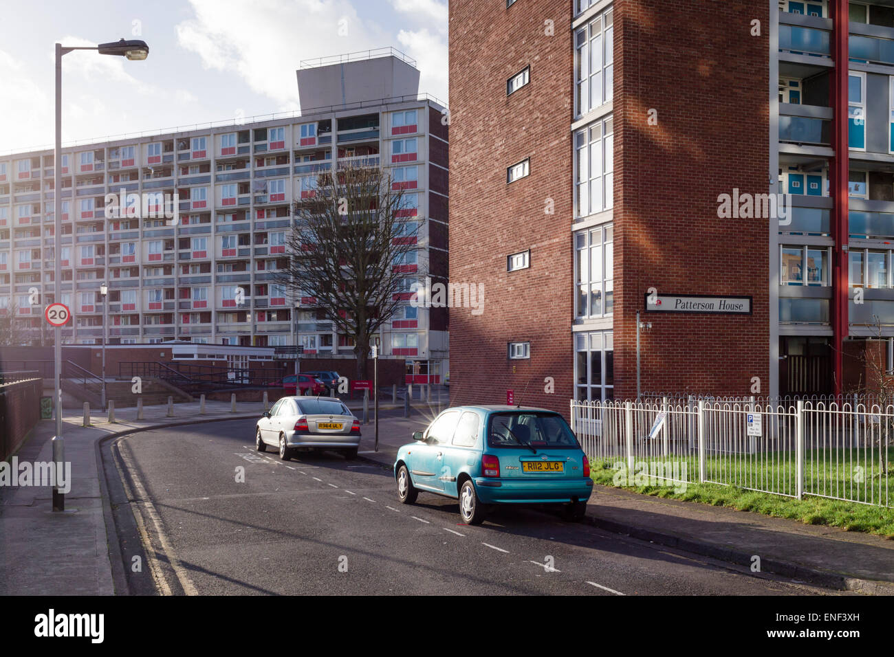 A road through a high-rise council estate of 1960s slab blocks in ...