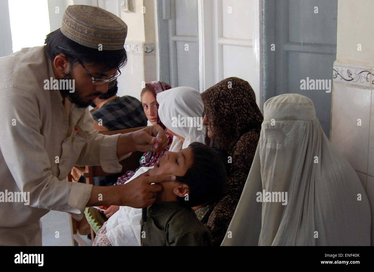 Health worker administrates polio-vaccine drops to a child during anti ...