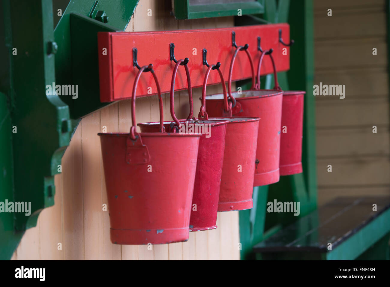 Fire buckets hanging in a row Stock Photo - Alamy