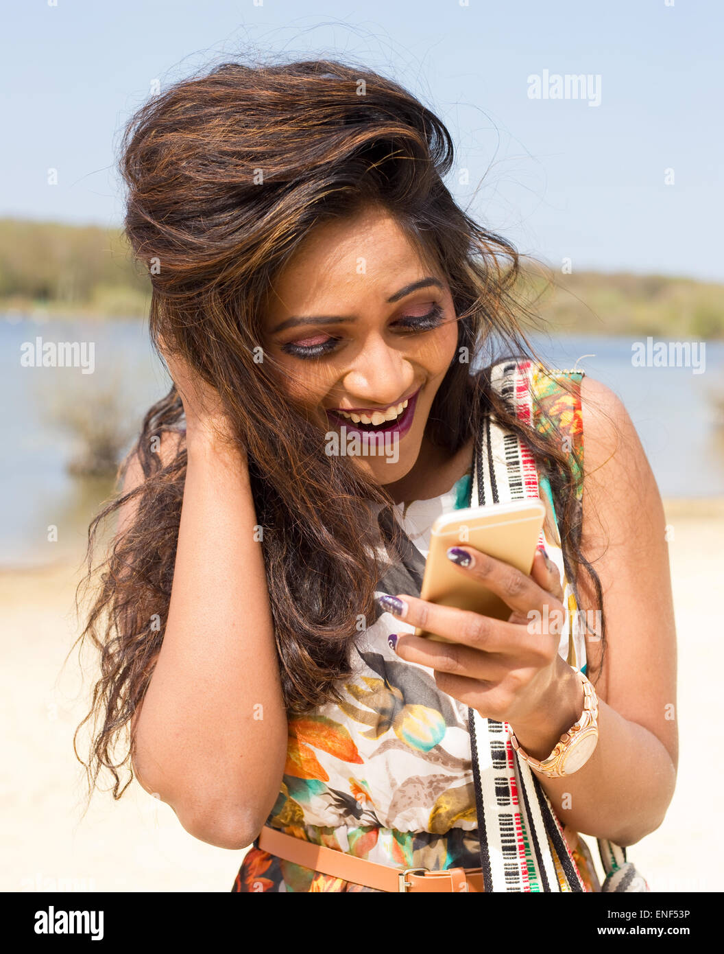young indian woman checking her text messages Stock Photo - Alamy young indian woman checking her text messages Stock Photo - Alamy