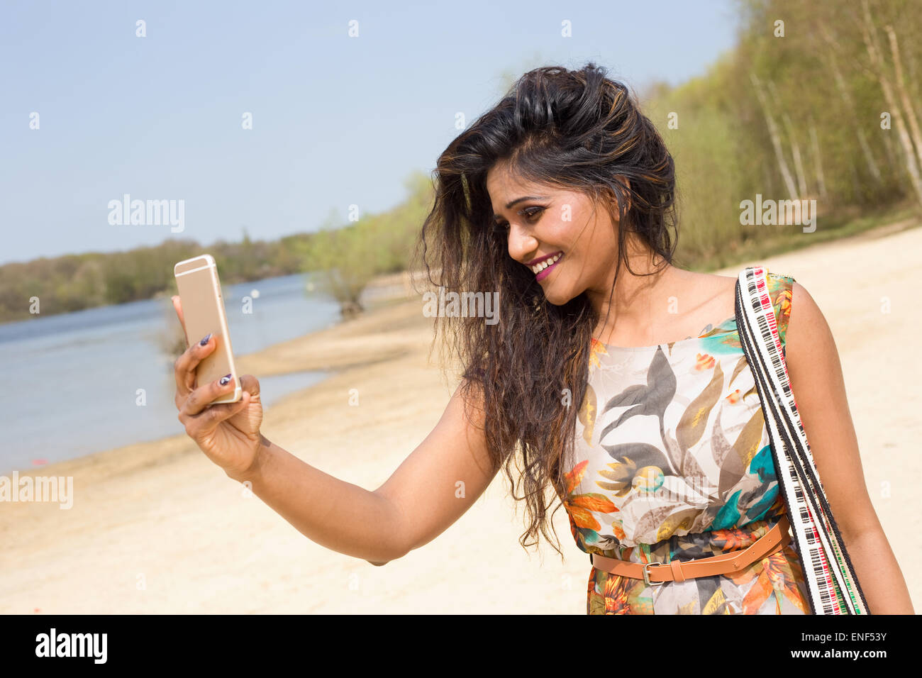 young indian woman taking a selfie Stock Photo - Alamy