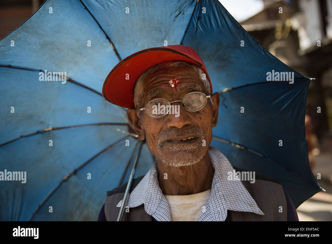 Patan, Nepal. 4th May, 2015. A Nepali man poses for a portrait as he ...