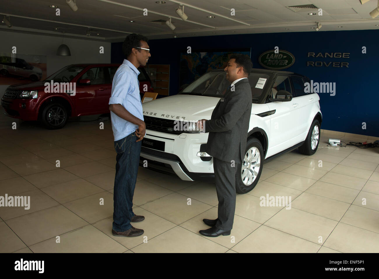 A potential customer discussing a deal on a Range Rover with the ...