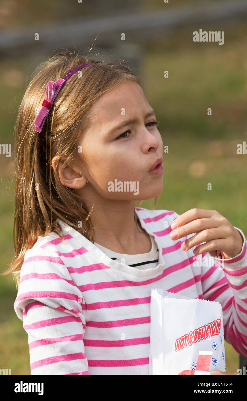 Child eating popcorn hi-res stock photography and images - Alamy