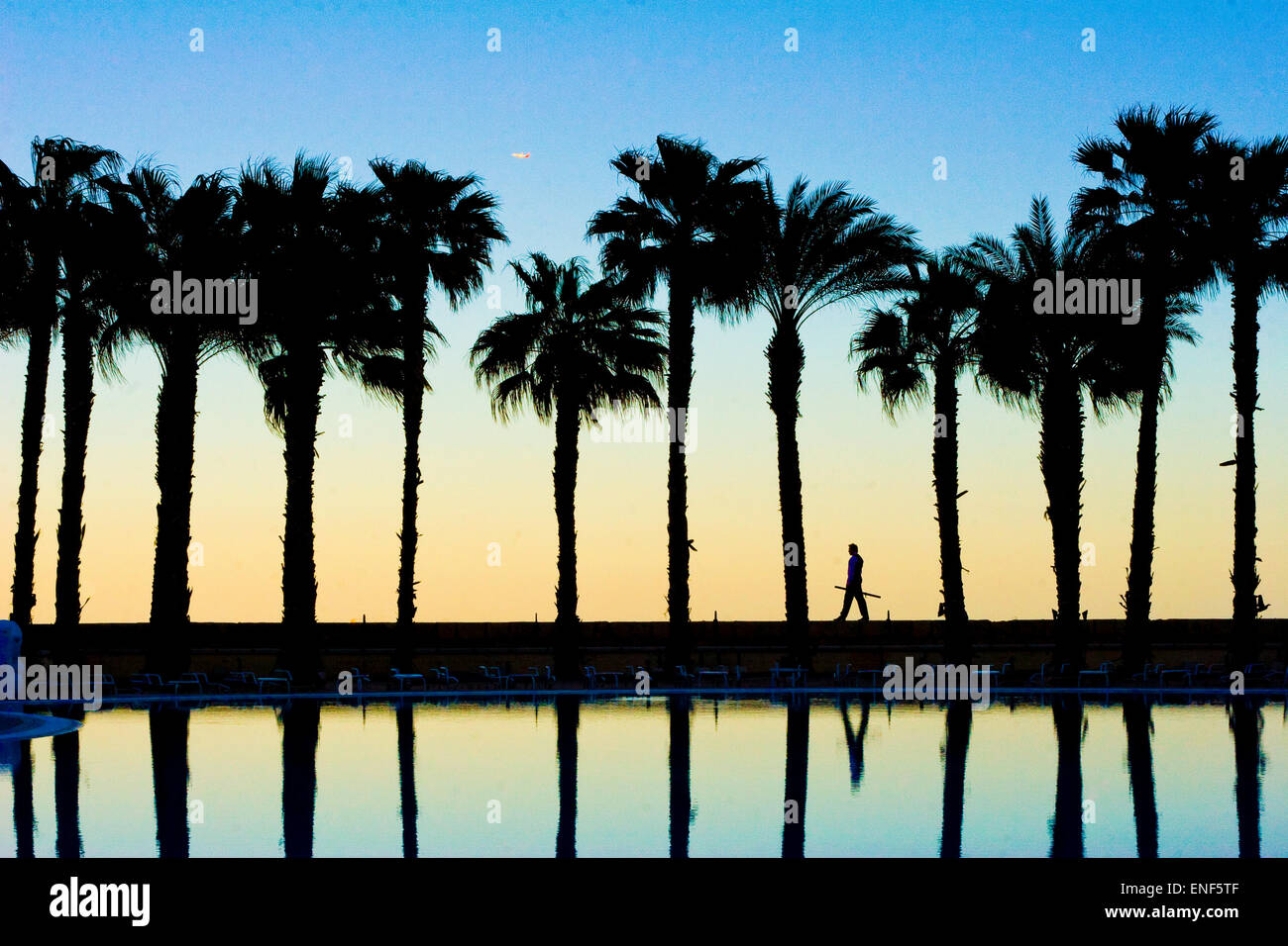 Dominic Dale (Wales) walks along the path by the swimming pool under ...