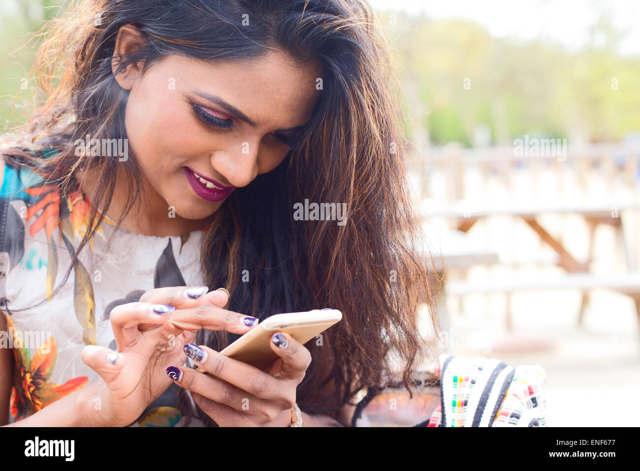 young woman sending a text message Stock Photo - Alamy