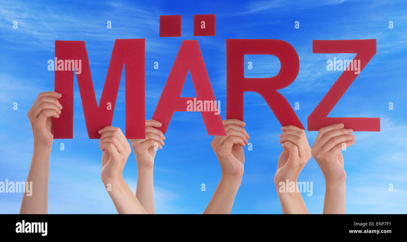 Hands Hold Straight Word Maerz Mean March Blue Sky Stock Photo - Alamy