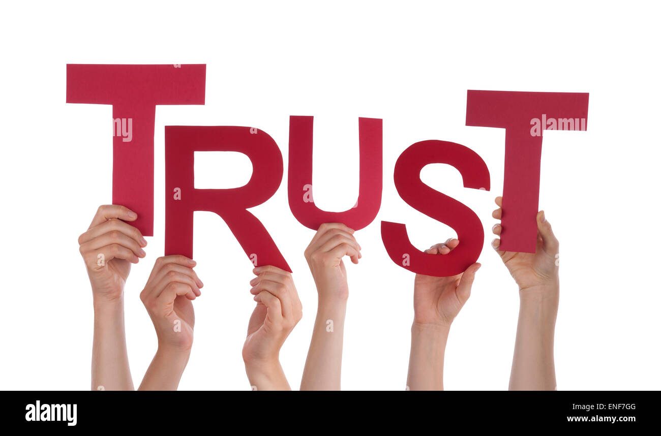 Many People Hands Holding Red Word Trust Stock Photo - Alamy