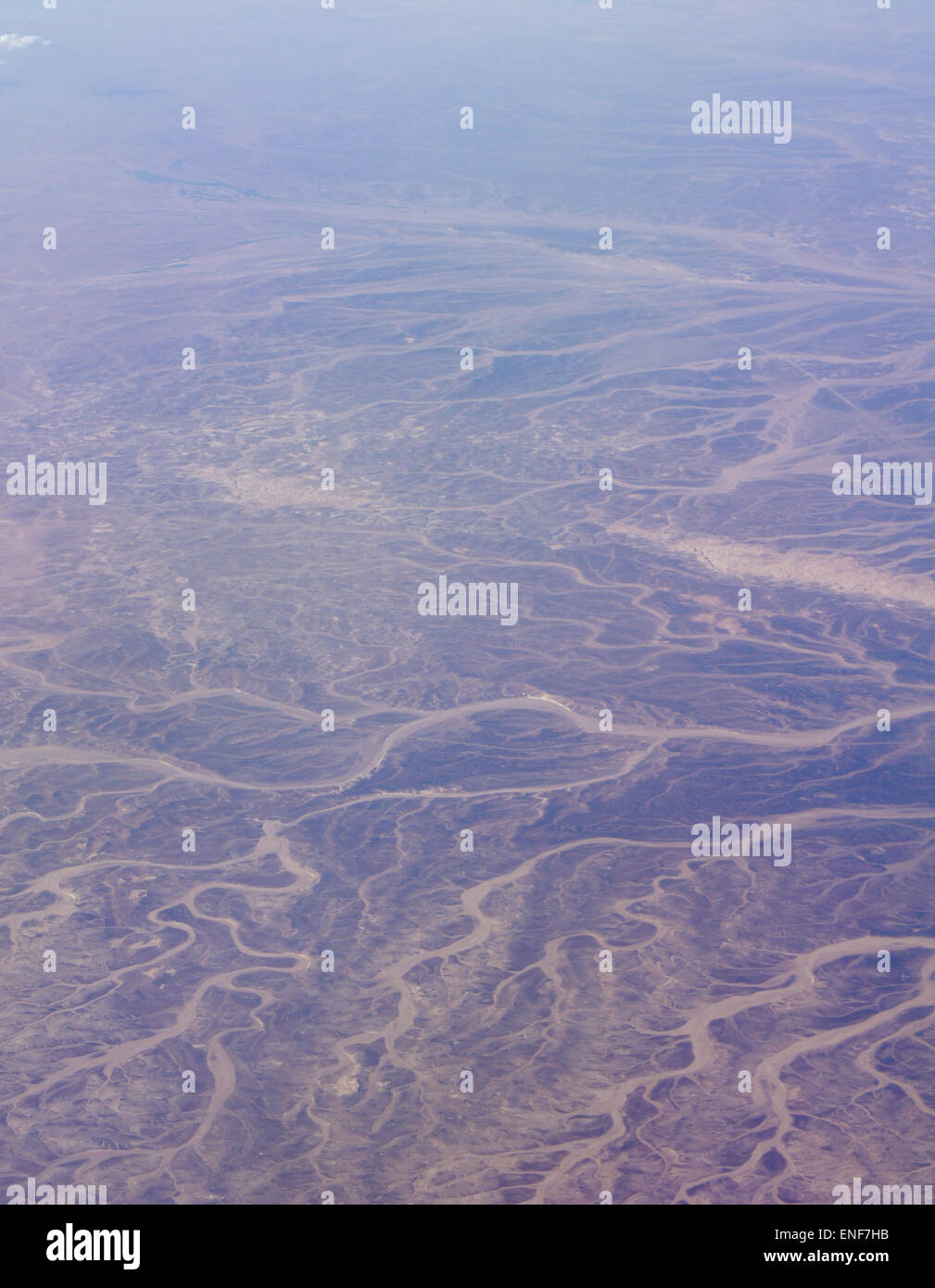 View of the desert from airplane window during flight Stock Photo - Alamy