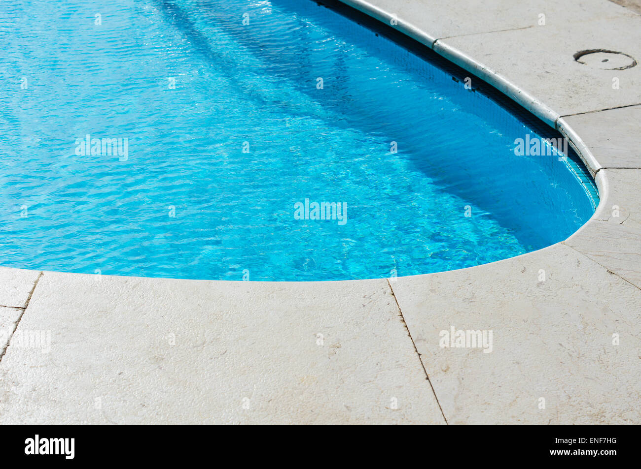 blue swimming pool with teak wood flooring stripes summer vacation ...