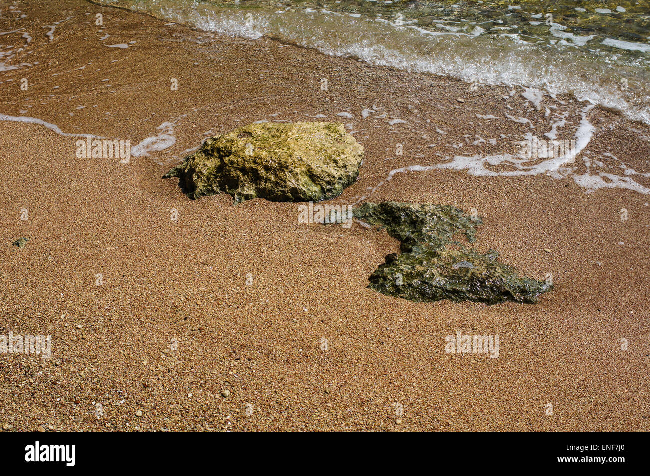 Sand beach of Red sea with rocks and waves Stock Photo - Alamy
