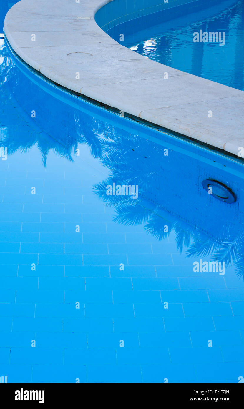 blue swimming pool with teak wood flooring stripes summer vacation ...