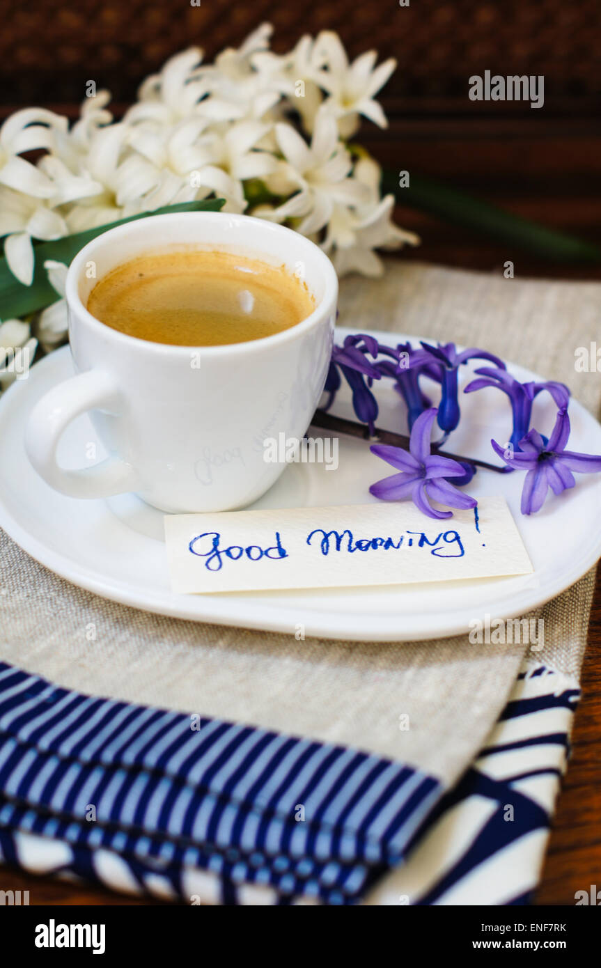 Coffee and first spring flowers on the table Stock Photo - Alamy