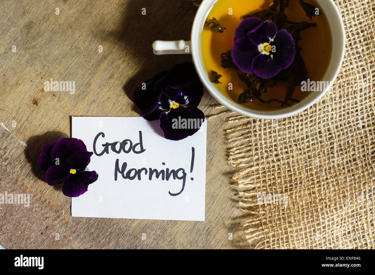 Cup o tea and spring flowers with good morning note Stock Photo - Alamy
