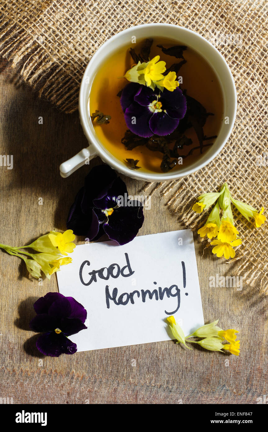 Cup o tea and spring flowers with good morning note Stock Photo - Alamy